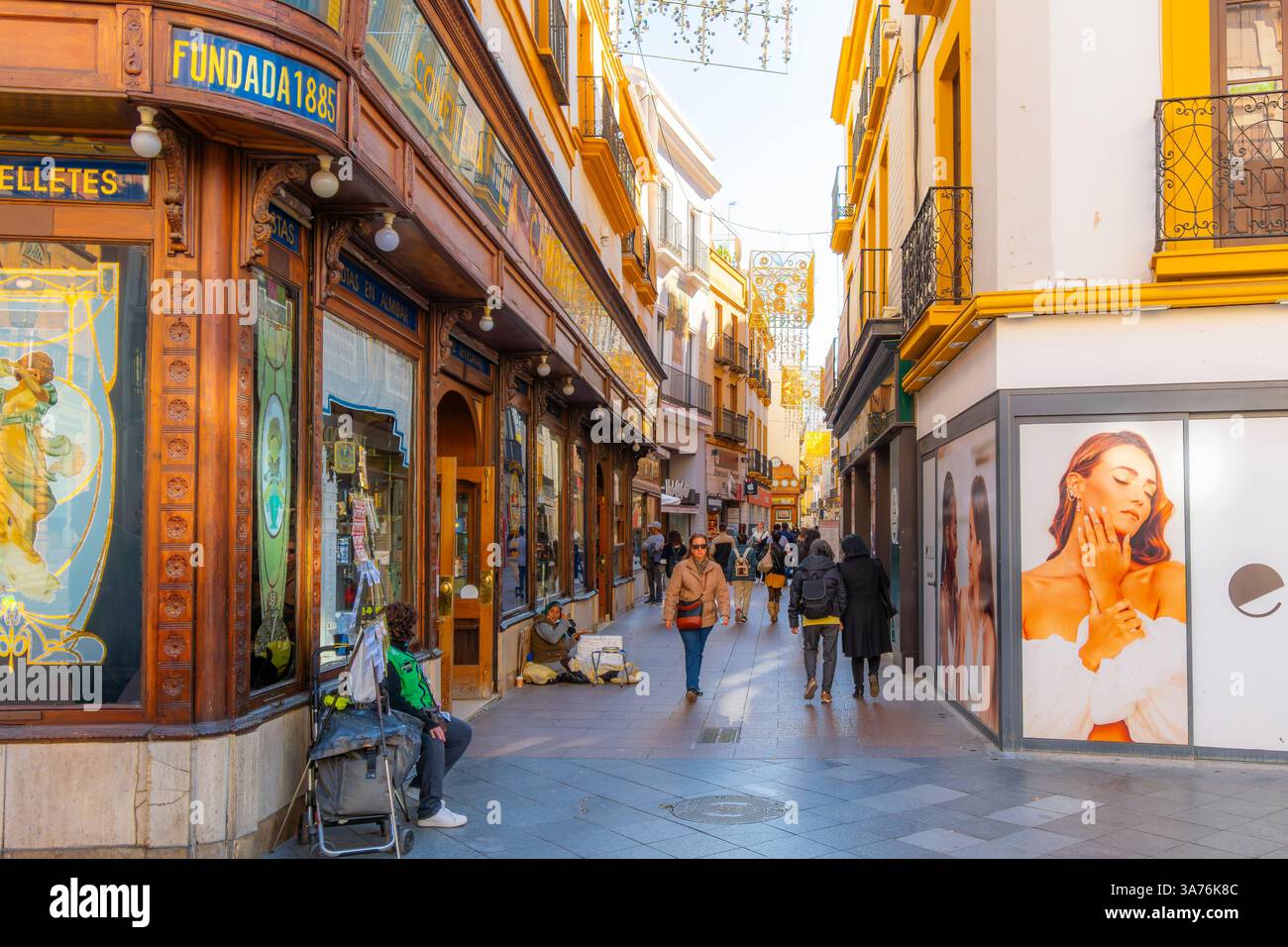 A busy alley full of shops, markets and cafes in the historic downtown ...