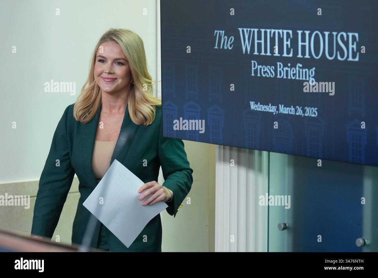 White House press secretary Karoline Leavitt walks up to the podium to speak with reporters in ...