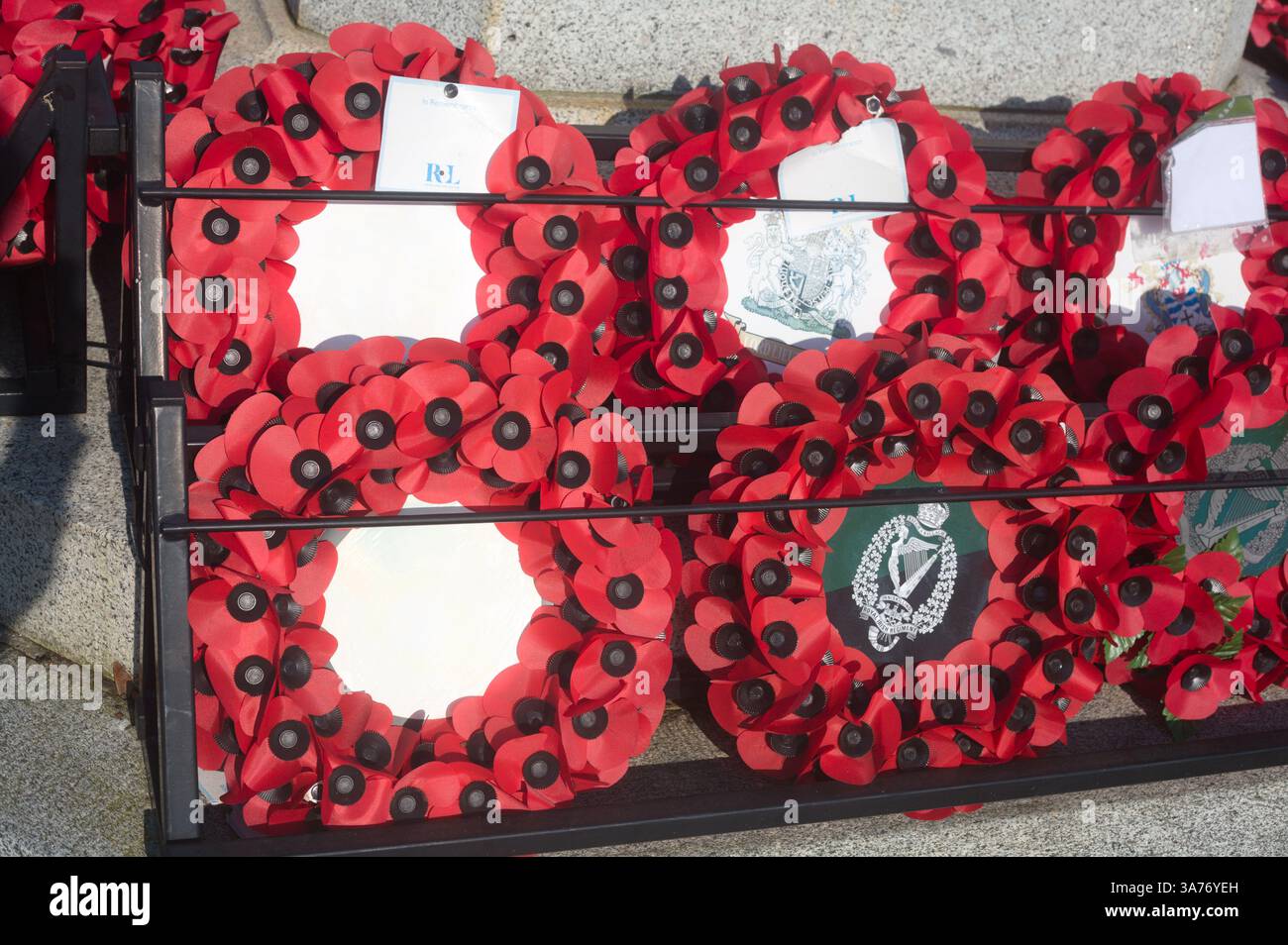 Poppy wreaths at the war memorial in the Square in Comber town centre ...