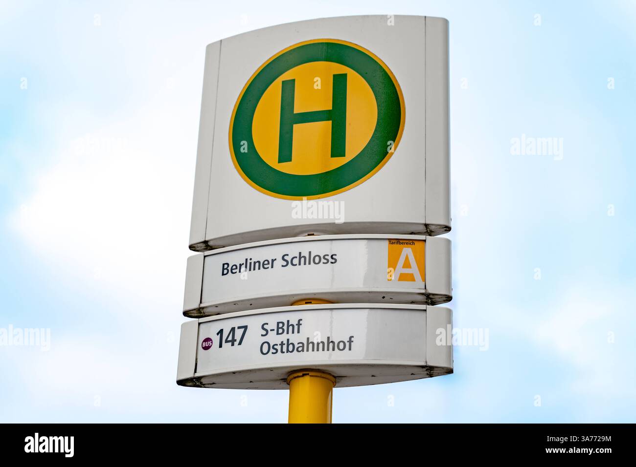 Berlin, Germany - March 25, 2025: A bus stop sign with the yellow-green ...