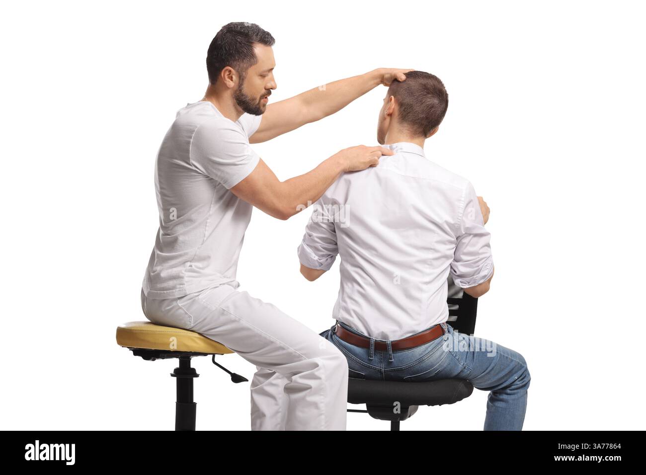 Chiropractor giving massage to a man isolated on white background Stock ...