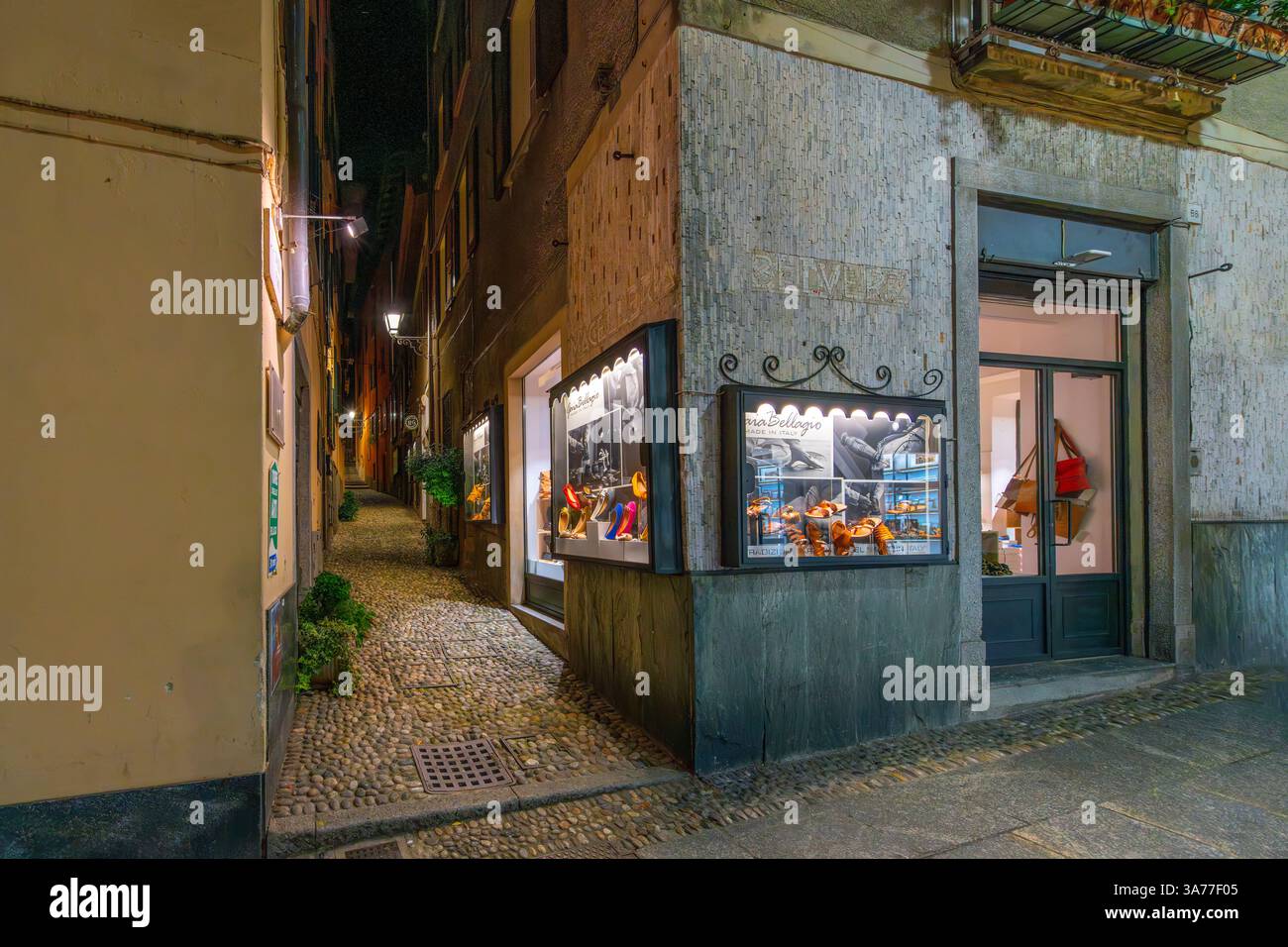 Narrow alleys of shops and cafes illuminated at night in the old town ...