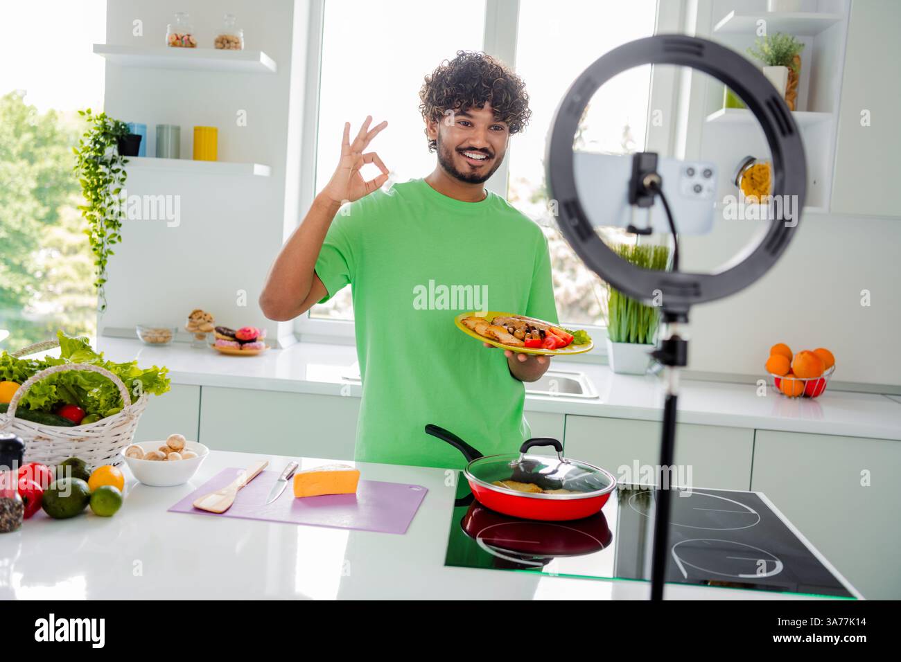 Young Male Chef Recording Cooking Content at Home in a Modern Kitchen ...