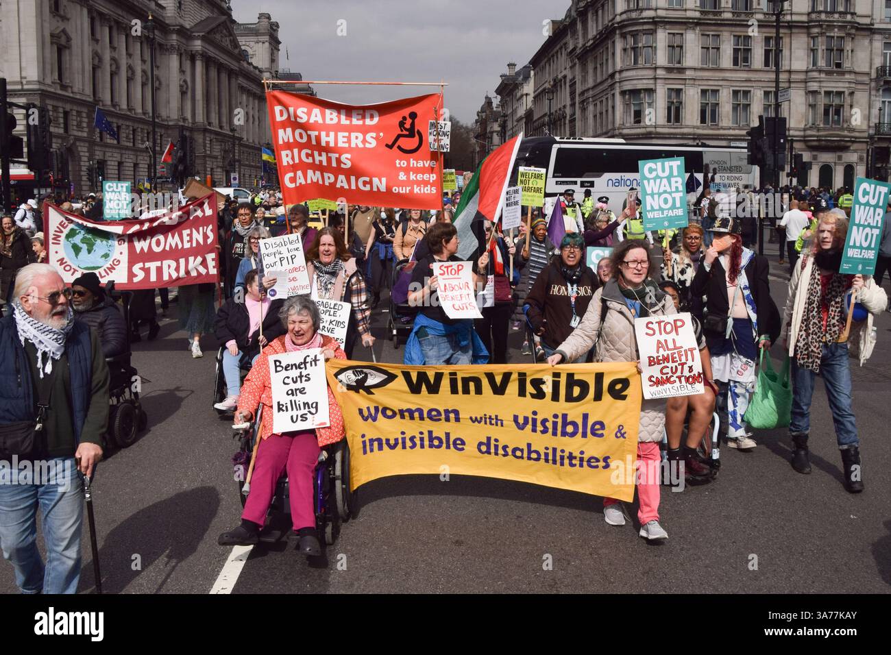 Protesters march with banners in Parliament Square during a ...