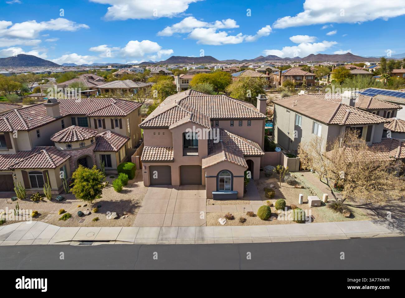 This is an aerial view of a large house situated in a residential area ...