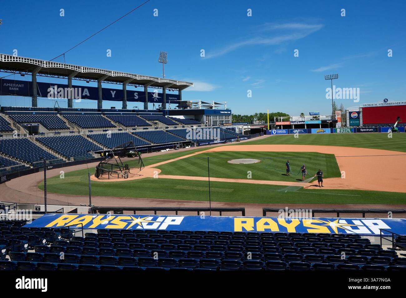 Tampa Bay Rays grounds crew members prepare the field for a practice at ...