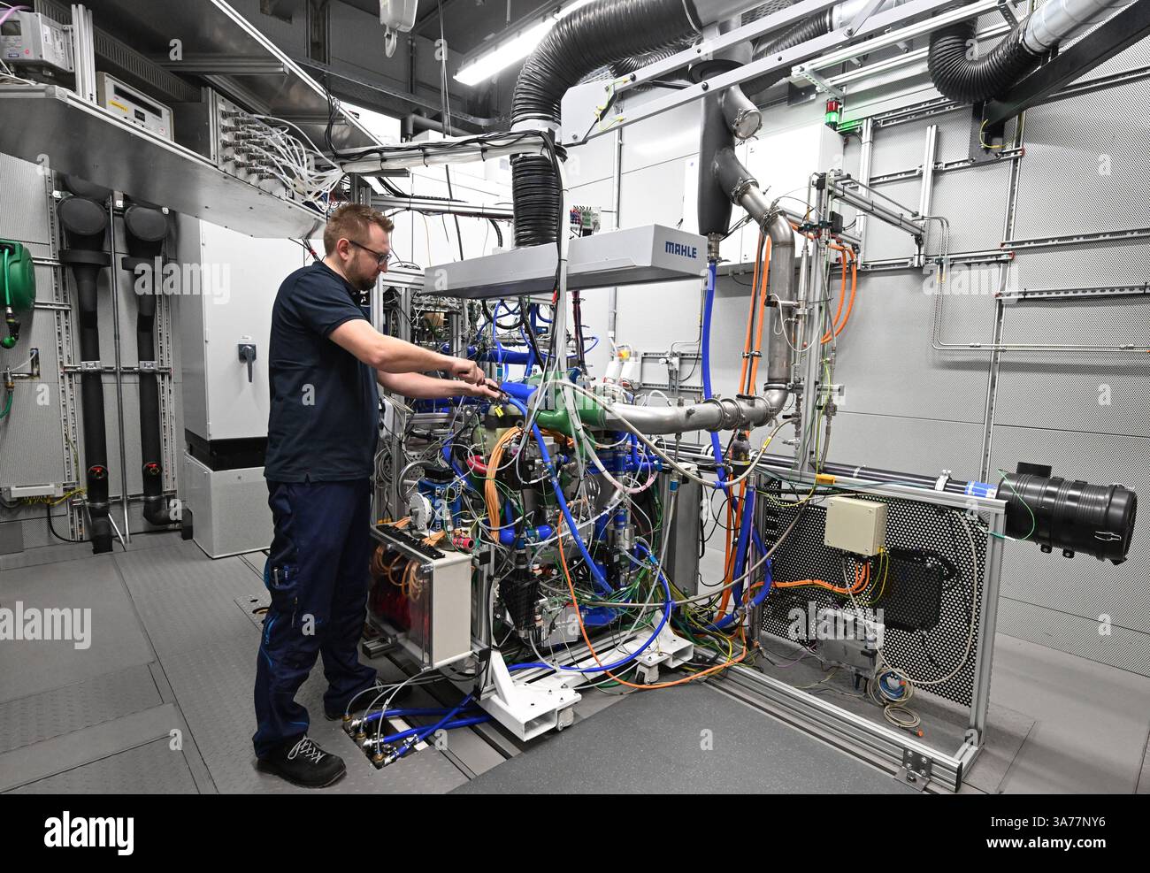 Stuttgart, Germany. 21st Mar, 2025. An employee of the automotive ...
