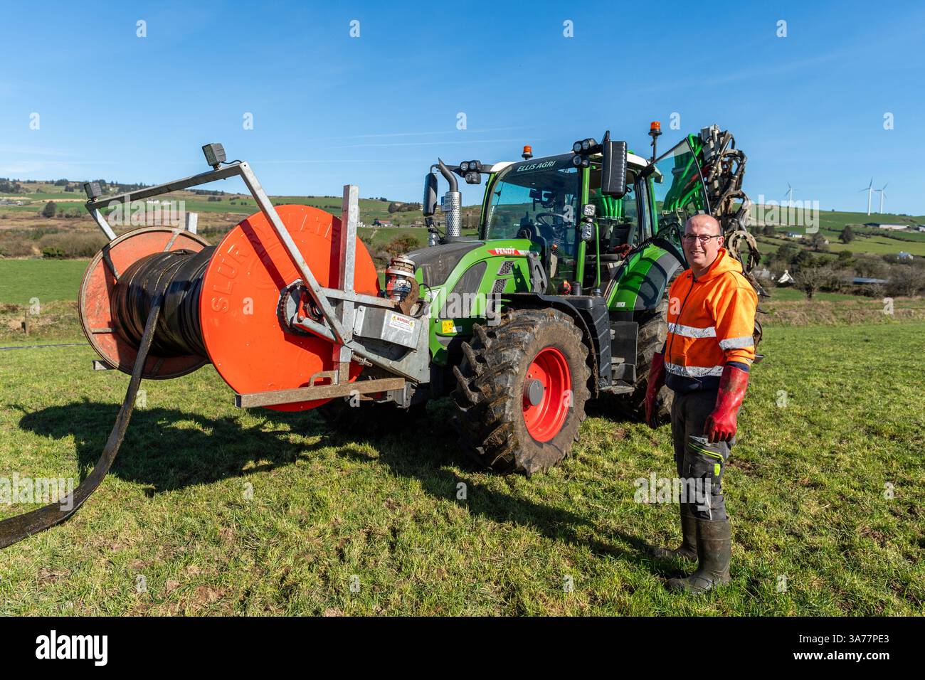 Farmer spreads slurry using an umbilical pump system and dribble bar ...