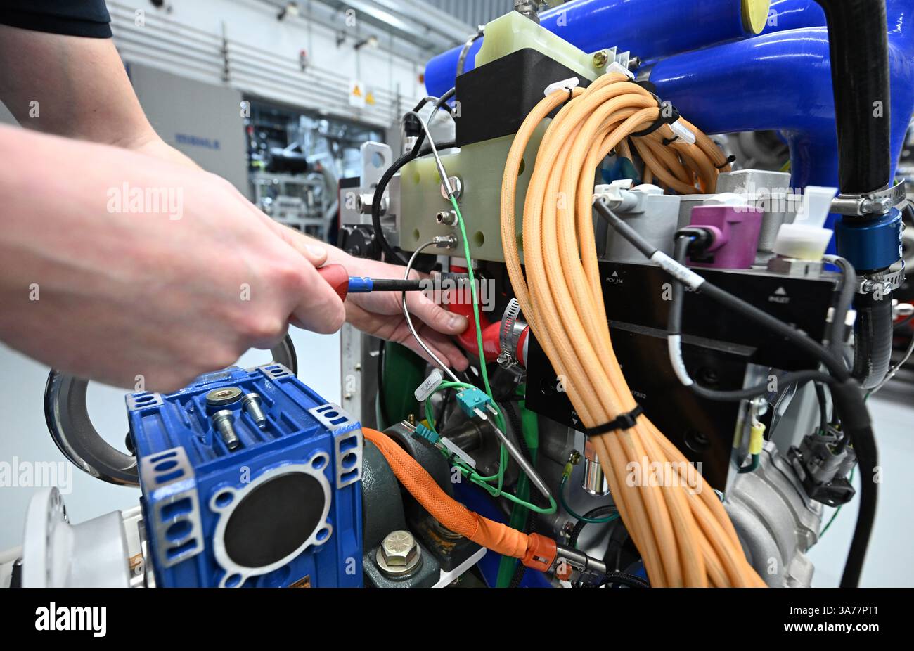 Stuttgart, Germany. 21st Mar, 2025. An employee of the automotive ...