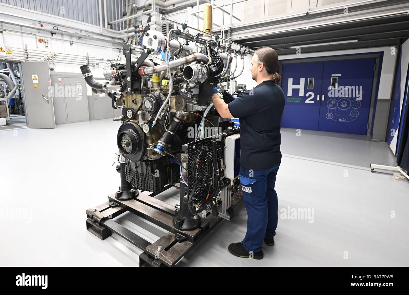 Stuttgart, Germany. 21st Mar, 2025. An employee of the automotive ...
