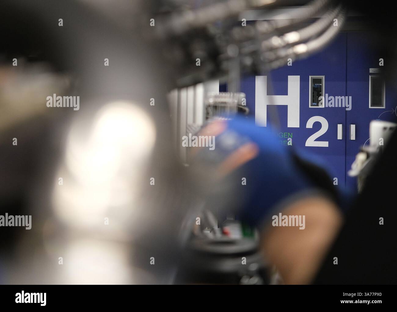 Stuttgart, Germany. 21st Mar, 2025. An employee of the automotive ...