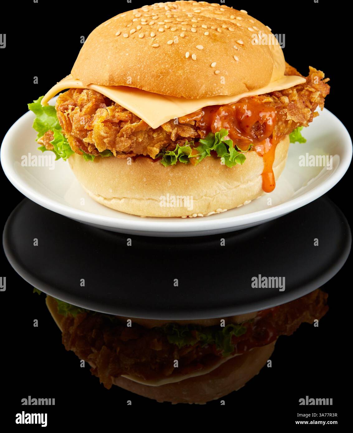 Indulge in a delicious chicken burger featuring a crispy fried chicken ...