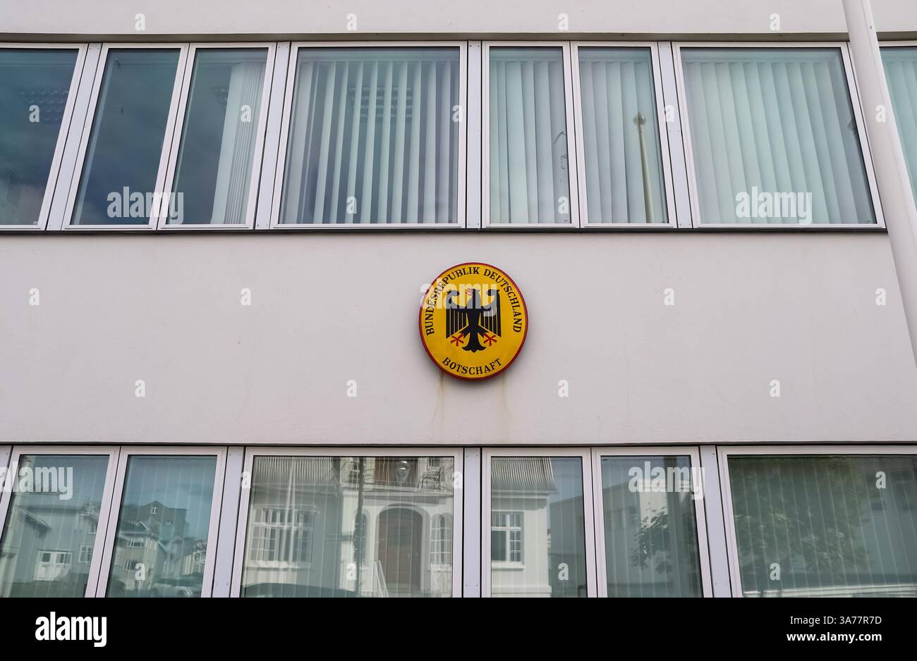 The German embassy in Reykjavik, Iceland, displays the German coat of ...