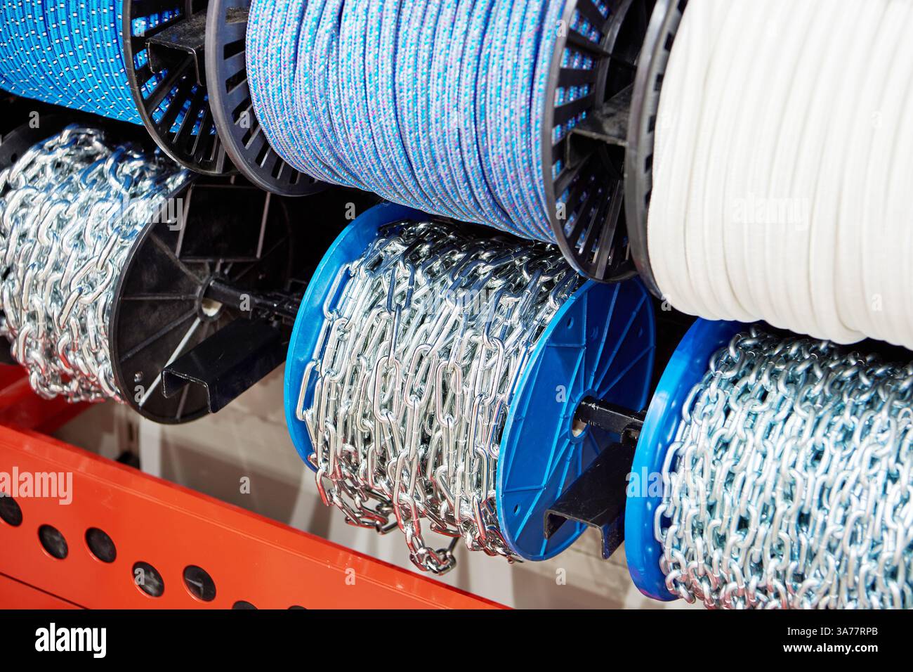 Metal chains and synthetic ropes in the store Stock Photo - Alamy