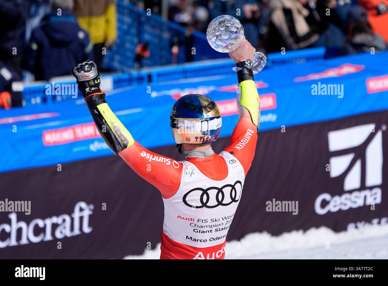 Switzerland's Marco Odermatt holds his trophy after winning the giant ...