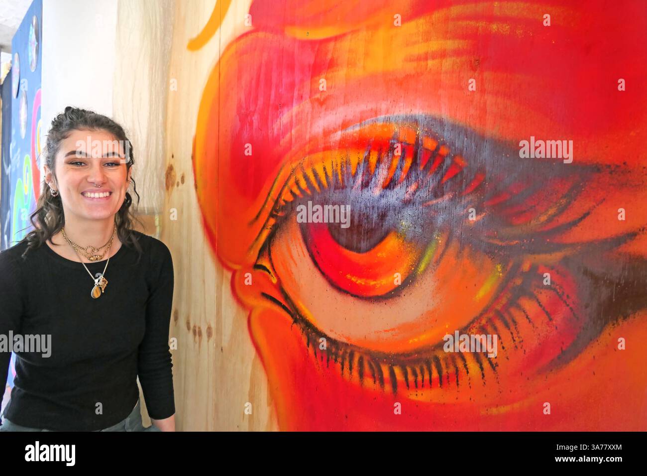 French artist Mélanie Le Hen, aka Meln Art, poses in front of her ...