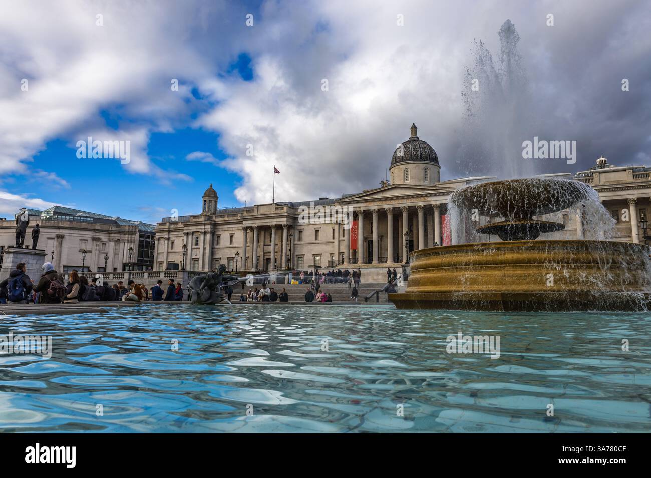 Scenic view of Trafalgar Square fountain and National Gallery in London ...