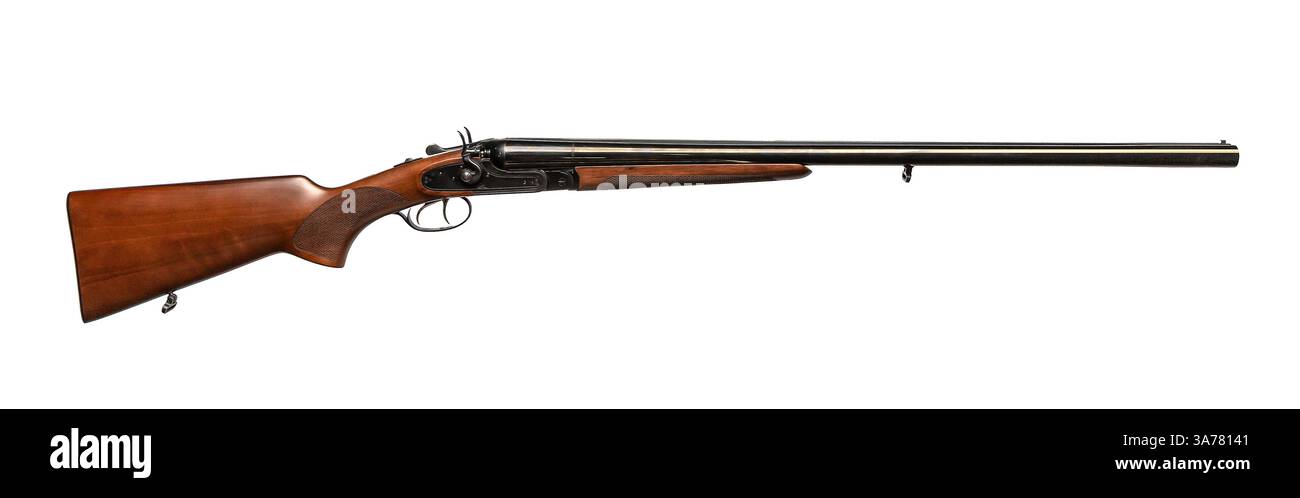 A classic double-barrel shotgun with a wooden stock and fore-end ...