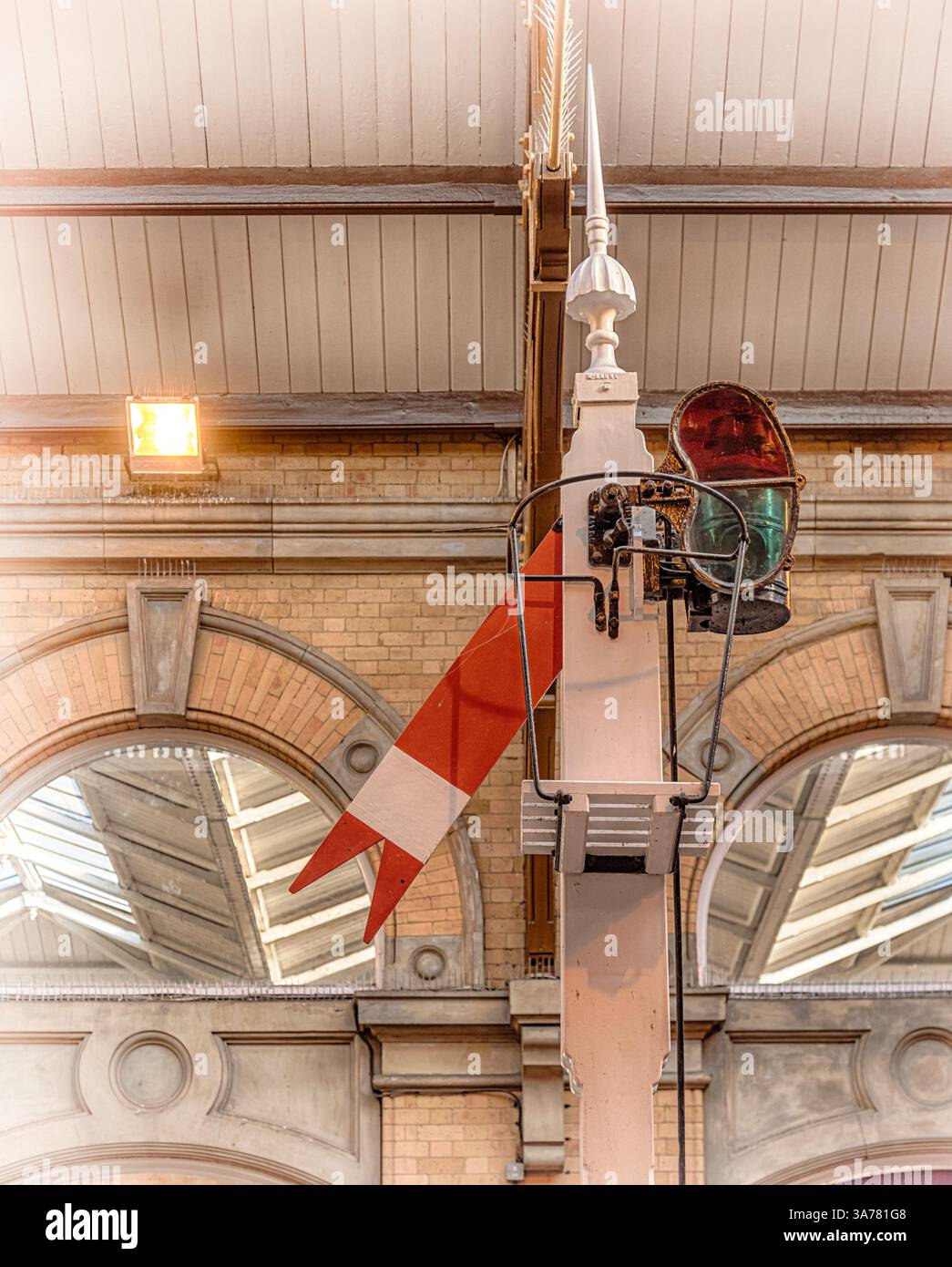 An old railway signal flag inside a railway station concourse. There ...