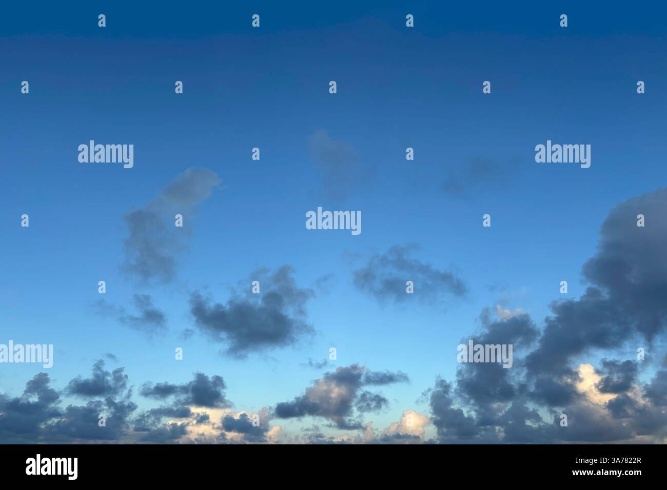 Cloudy summer sky with small clouds for use as a background texture ...