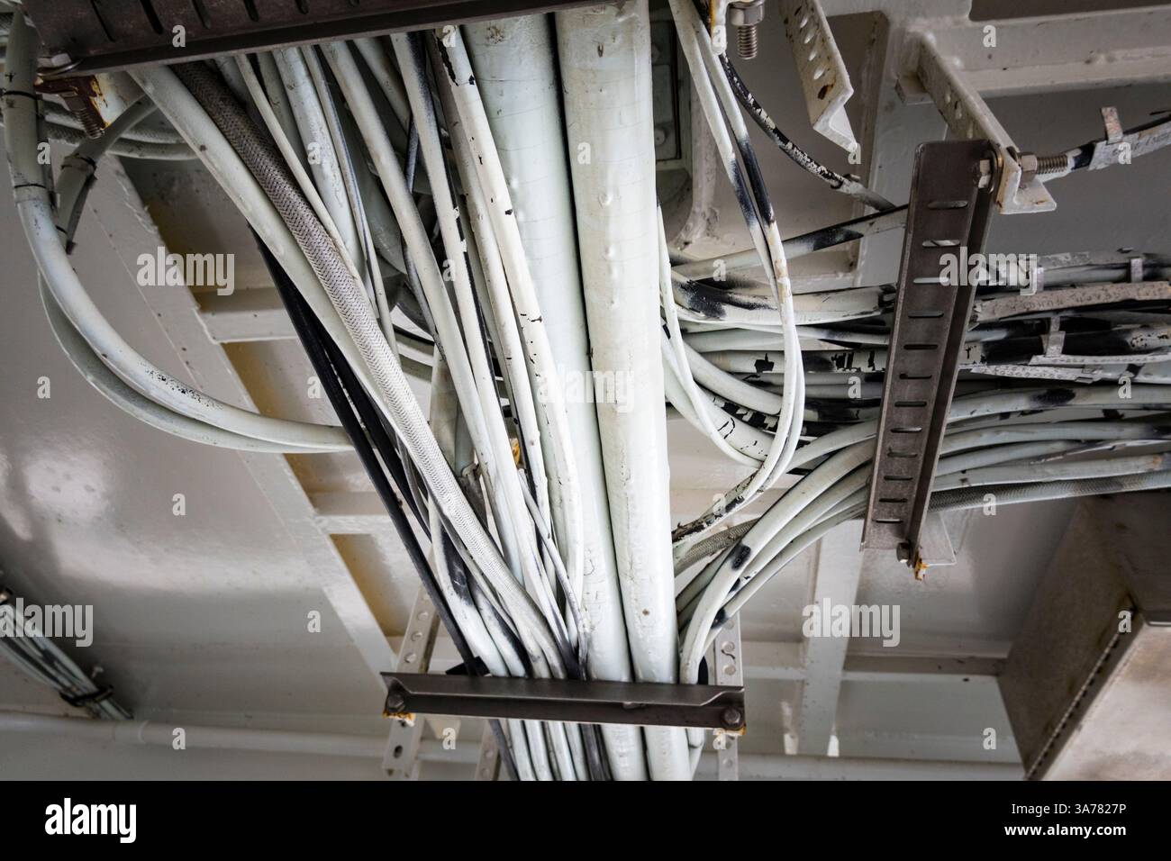 Electrical cables running along the ceiling of a ferry cabin ceiling ...