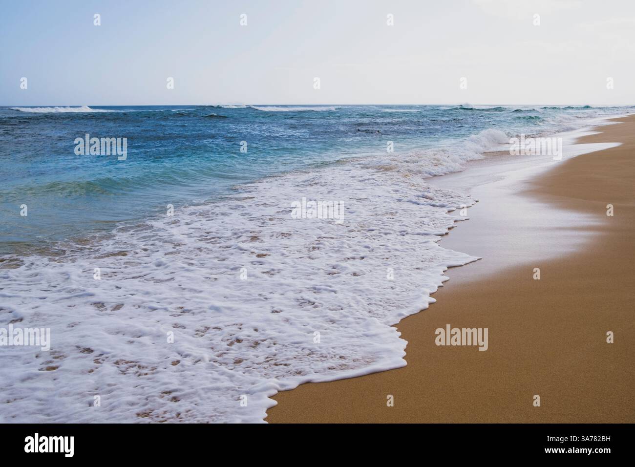 Beach and surf along Oahu's wild North Shore, waves breaking on the ...
