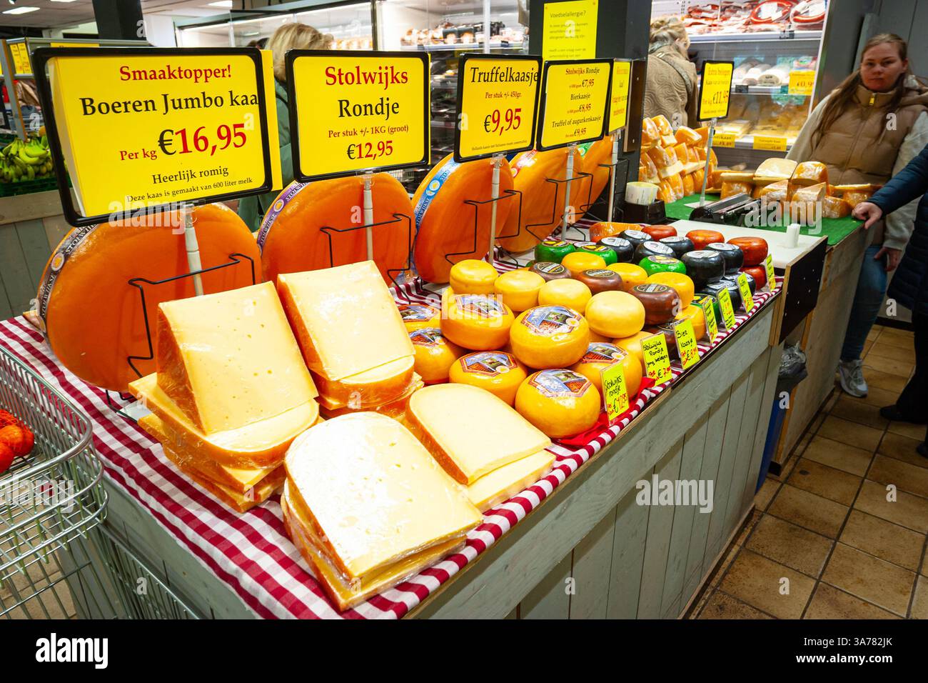 Stall selling various types of Dutch cheese at a traditional old market ...