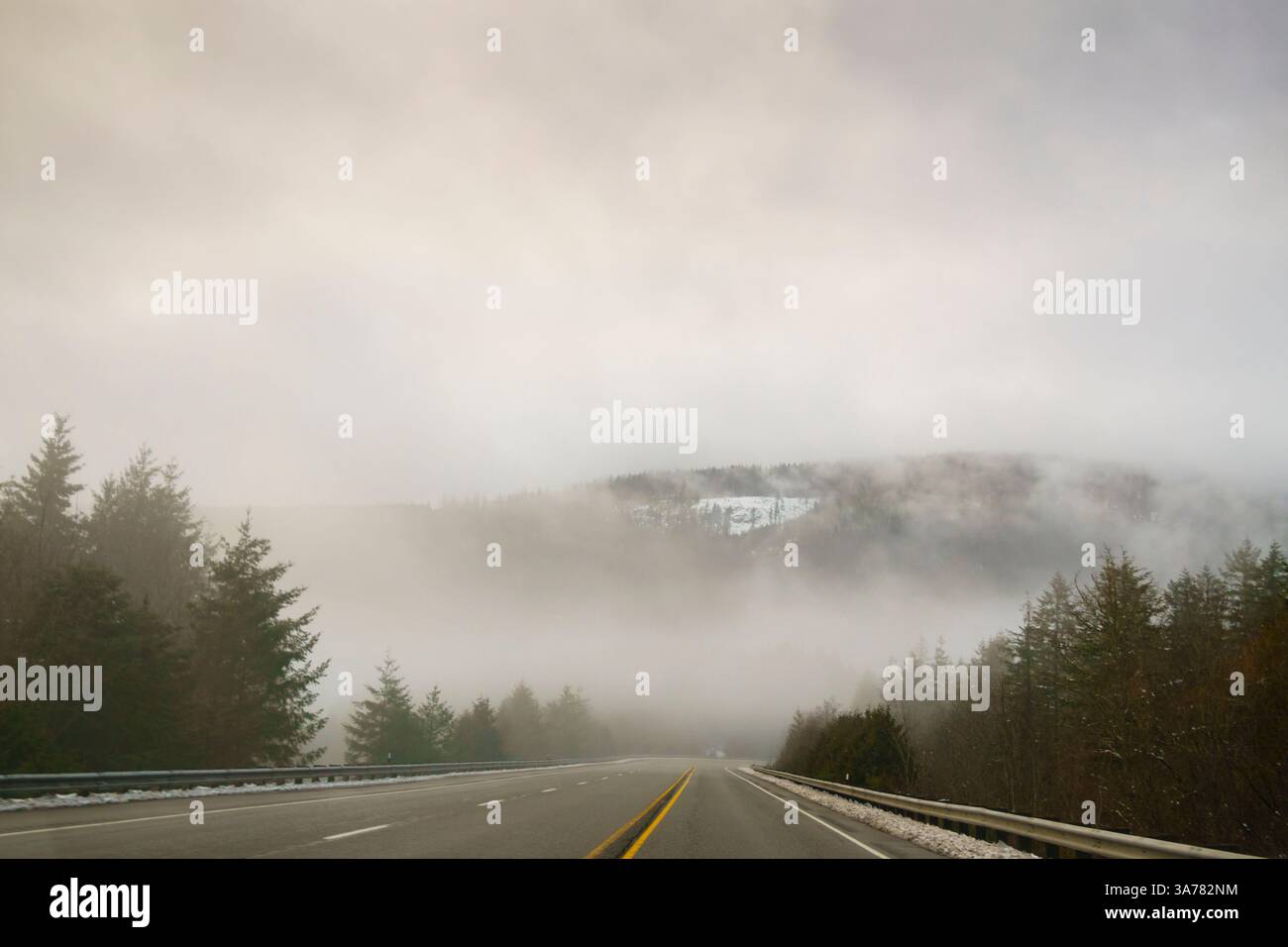 The Driver's view through the windshield of a winding road through the ...