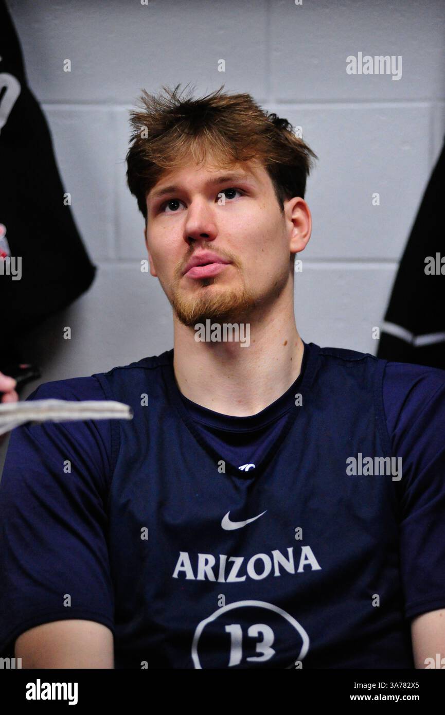 Arizona Wildcats' Henri Veesaar gives an interview in the locker room ...