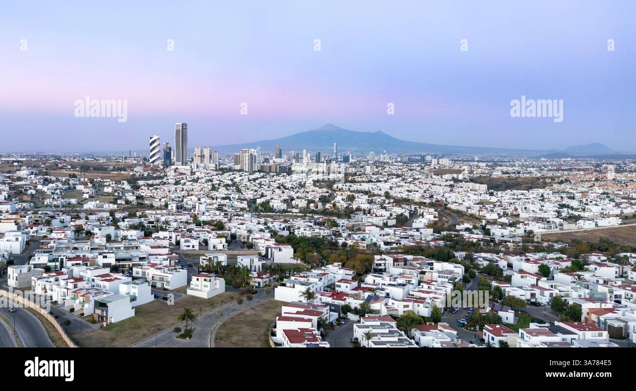A panoramic view of modern Puebla, Mexico, featuring residential ...
