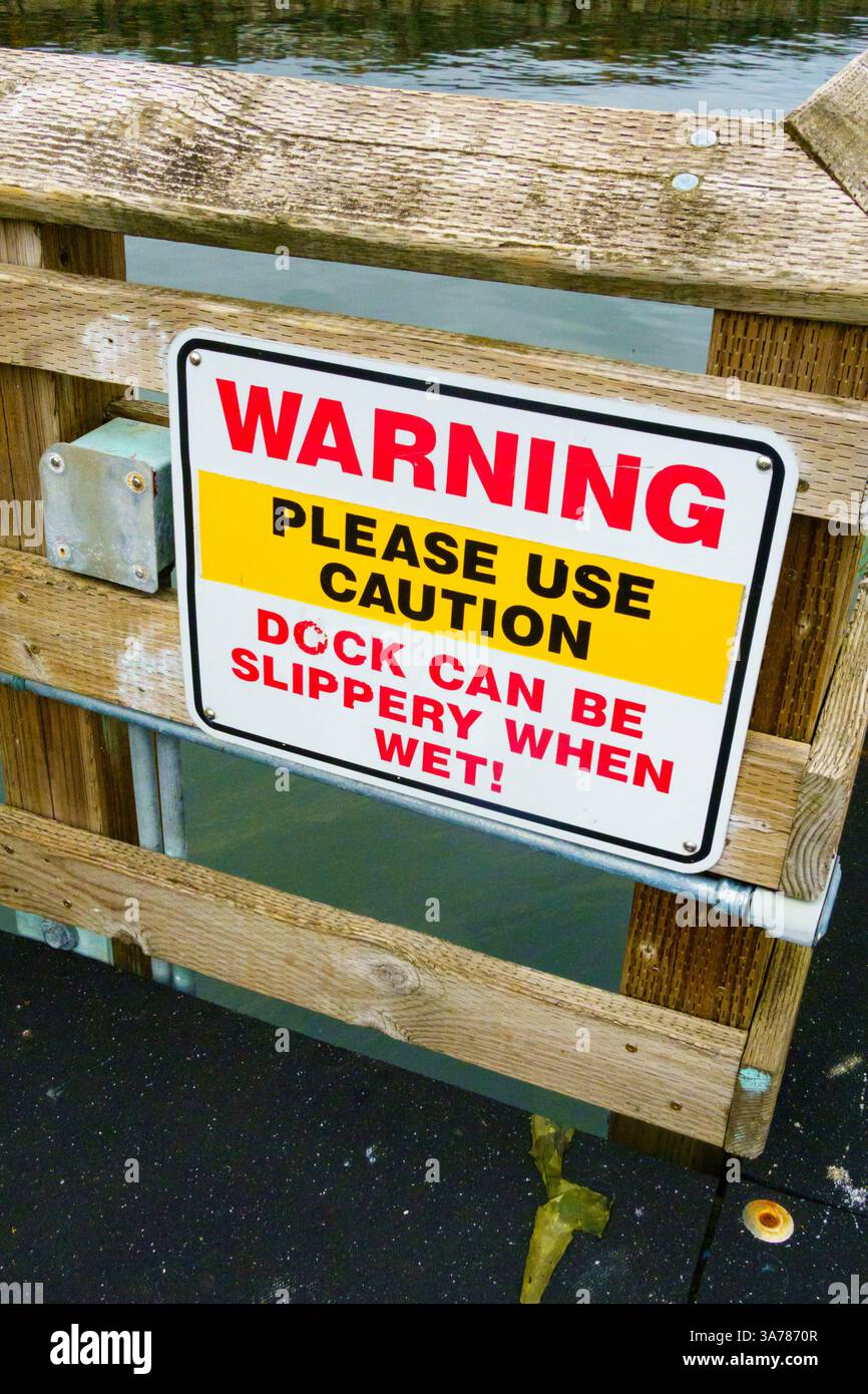 Warning sign on a wooden dock, red lettering, Please Use Caution, Deck ...