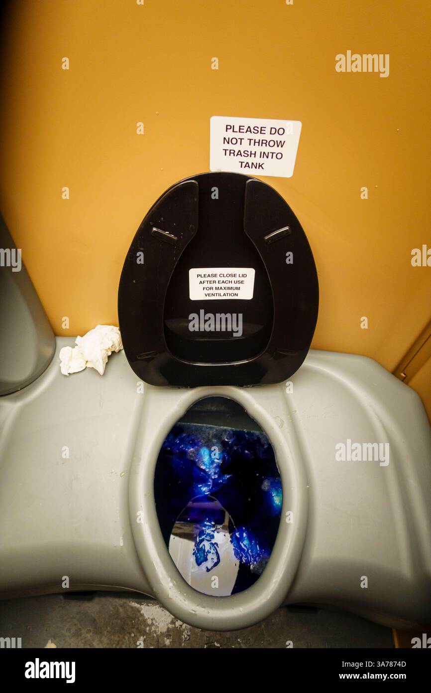 A public restroom toilet cubicle, a toilet at a reststop on a major ...