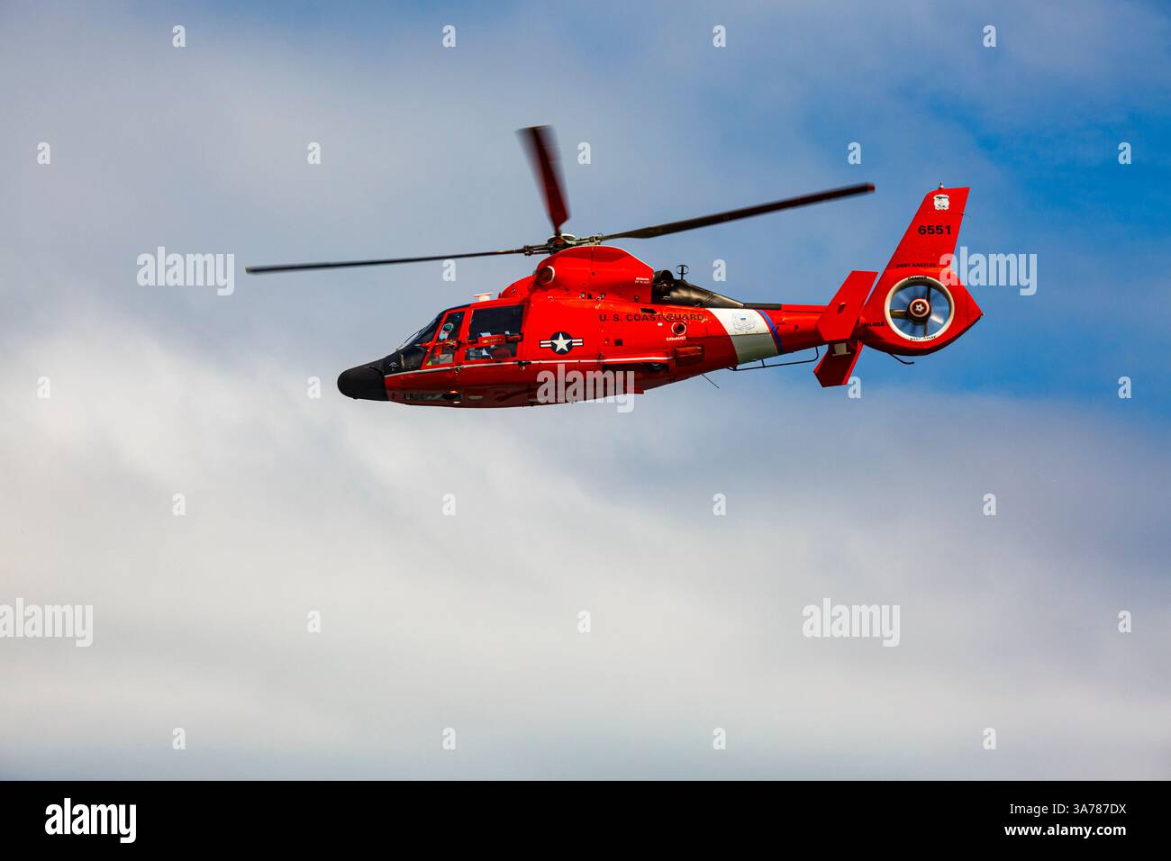 US Coast Guard helicopter hovering over the water in a demo of a rescue ...