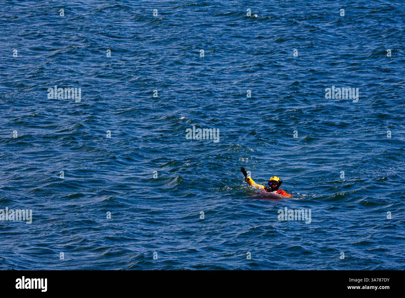 US Coast Guard helicopter demo rescue with rescue swimmer in the water ...