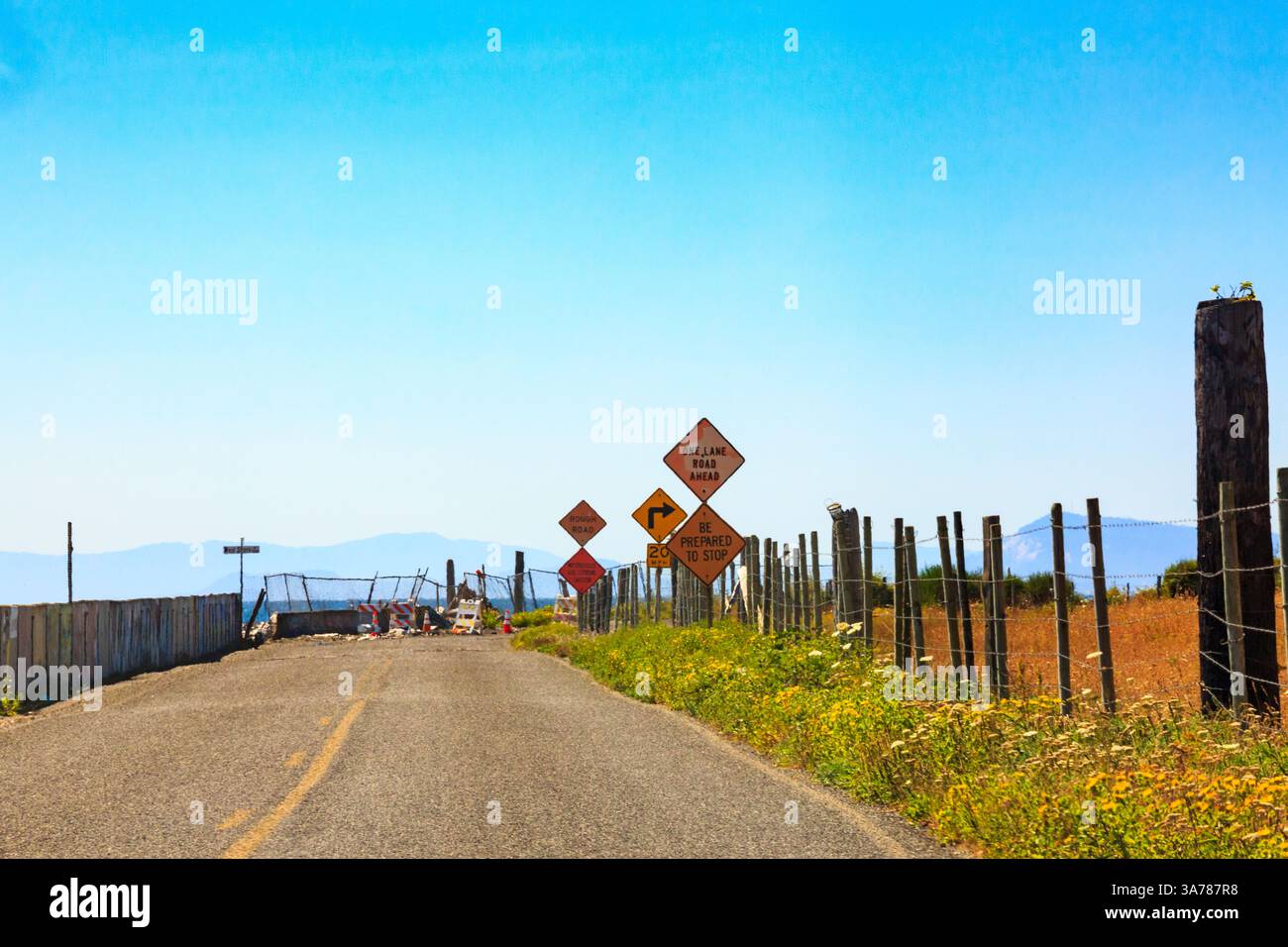 Shoreline erosion, damage to a coastal road on Lummi Island, rubble and ...