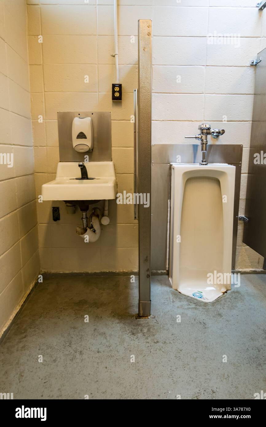A public restroom urinal, a toilet at a reststop on a major road Stock ...