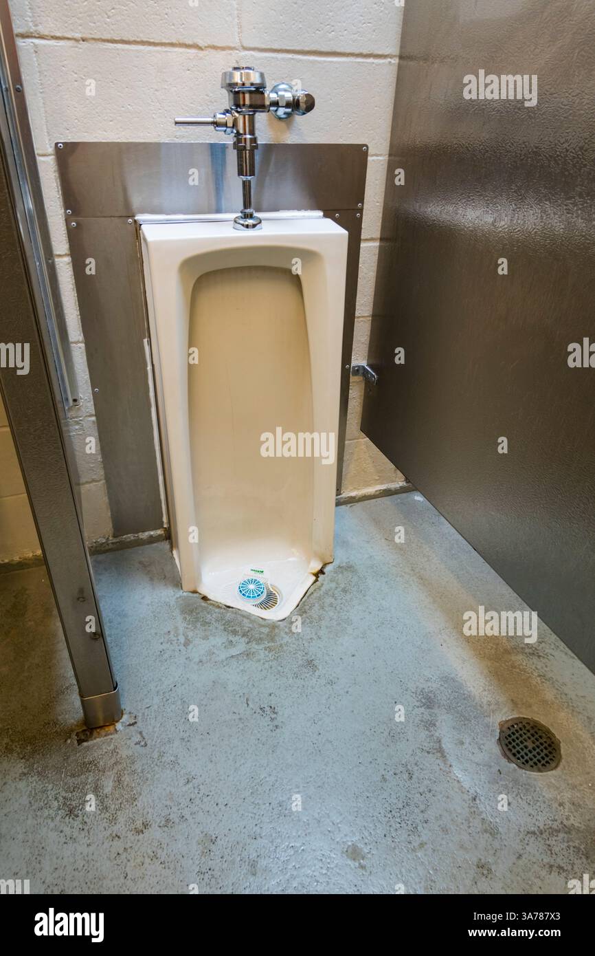 A public restroom urinal, a toilet at a reststop on a major road Stock ...