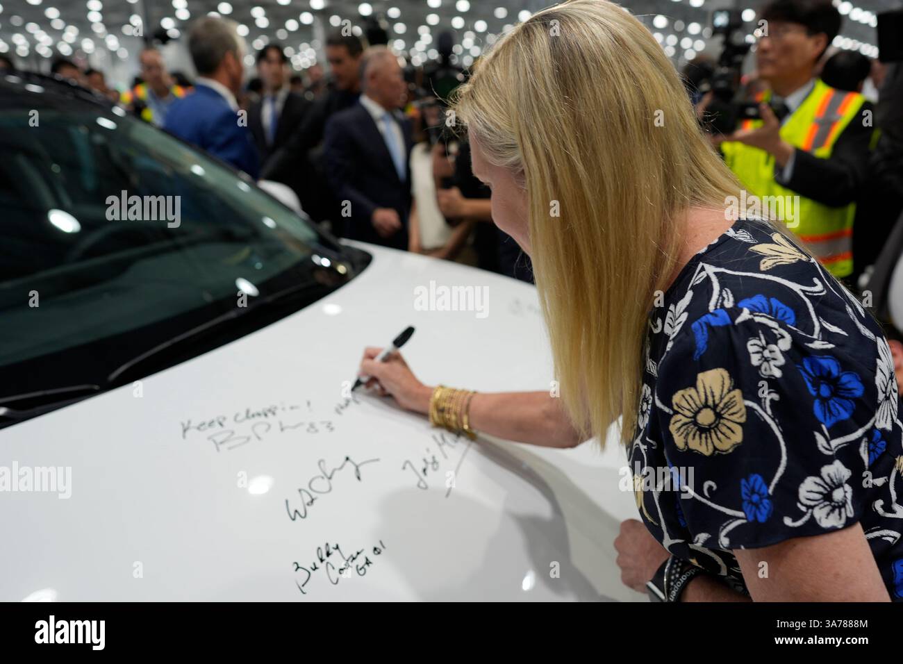 First Lady of Georgia, Marty Kemp, signs a vehicle during during grand ...
