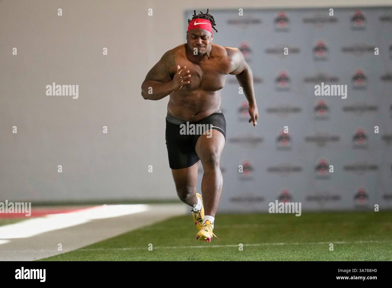 Ohio State defensive lineman Ty Hamilton runs the 40 during the school ...