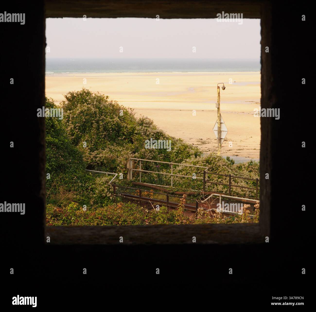 Looking out of a pill box war defence lookout building above ...