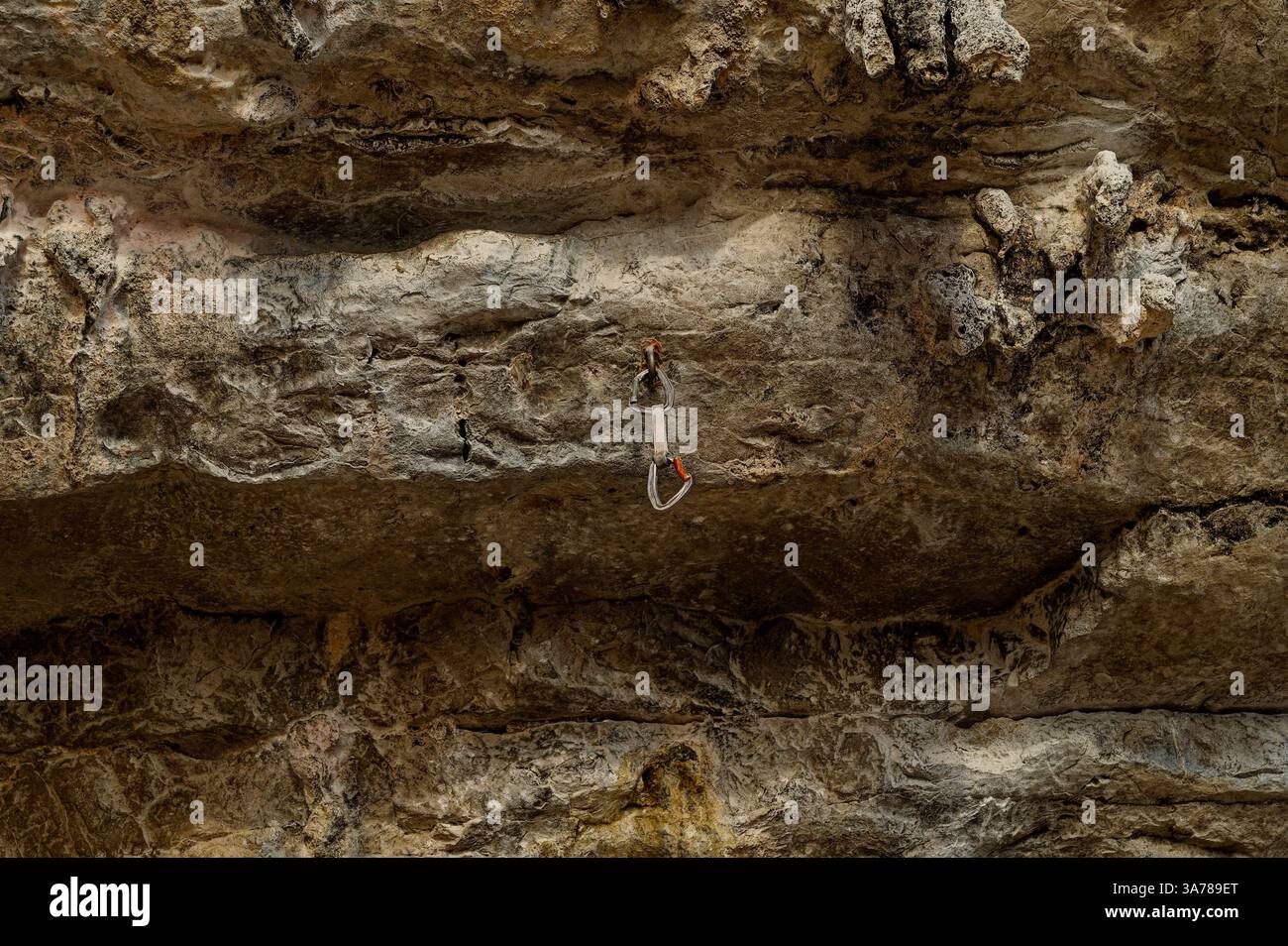 Lone quickdraw clipped to a limestone overhang in Tonsai, evidence of ...