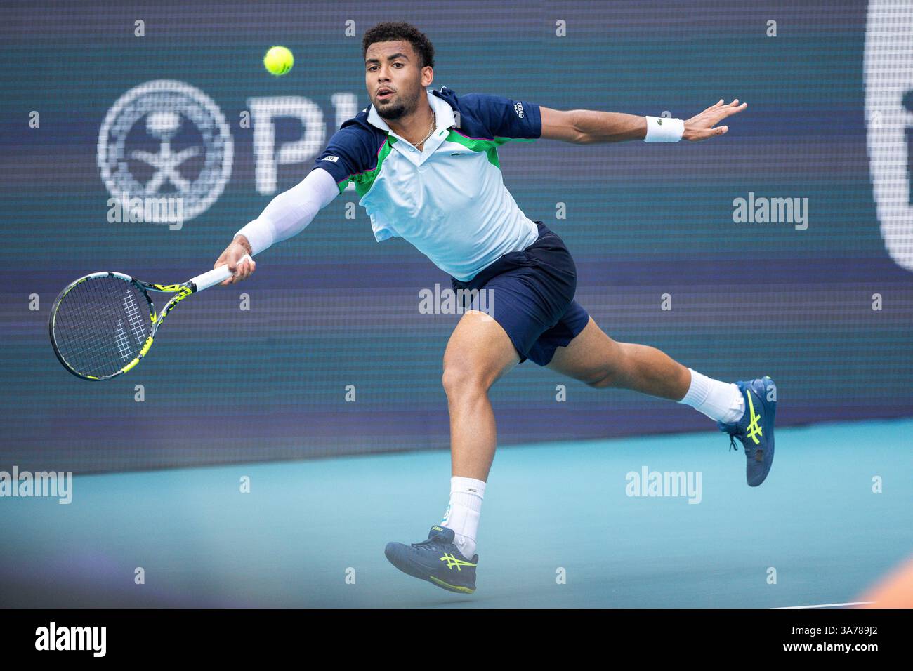 Arthur Fils of France returns the ball during the Miami Open tennis ...