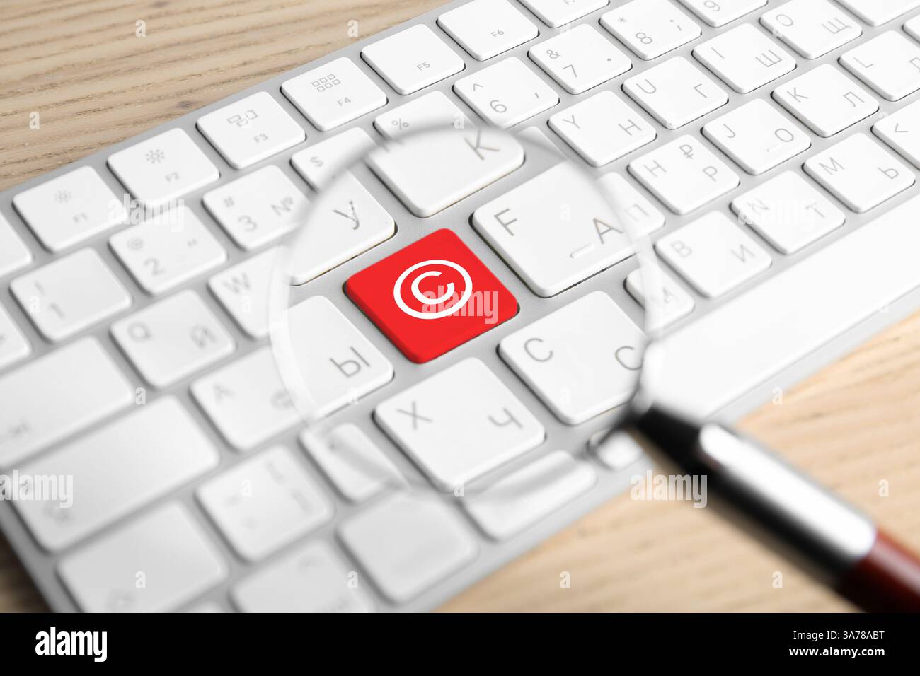 License. Computer keyboard with Copyright sign on red button, view ...