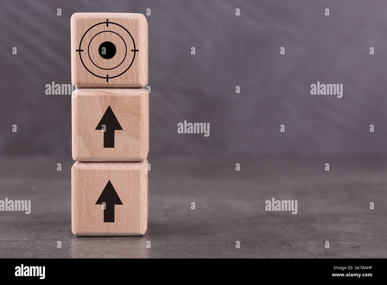 Targeting. Stacked cubes with arrows pointing at one with bullseye on ...