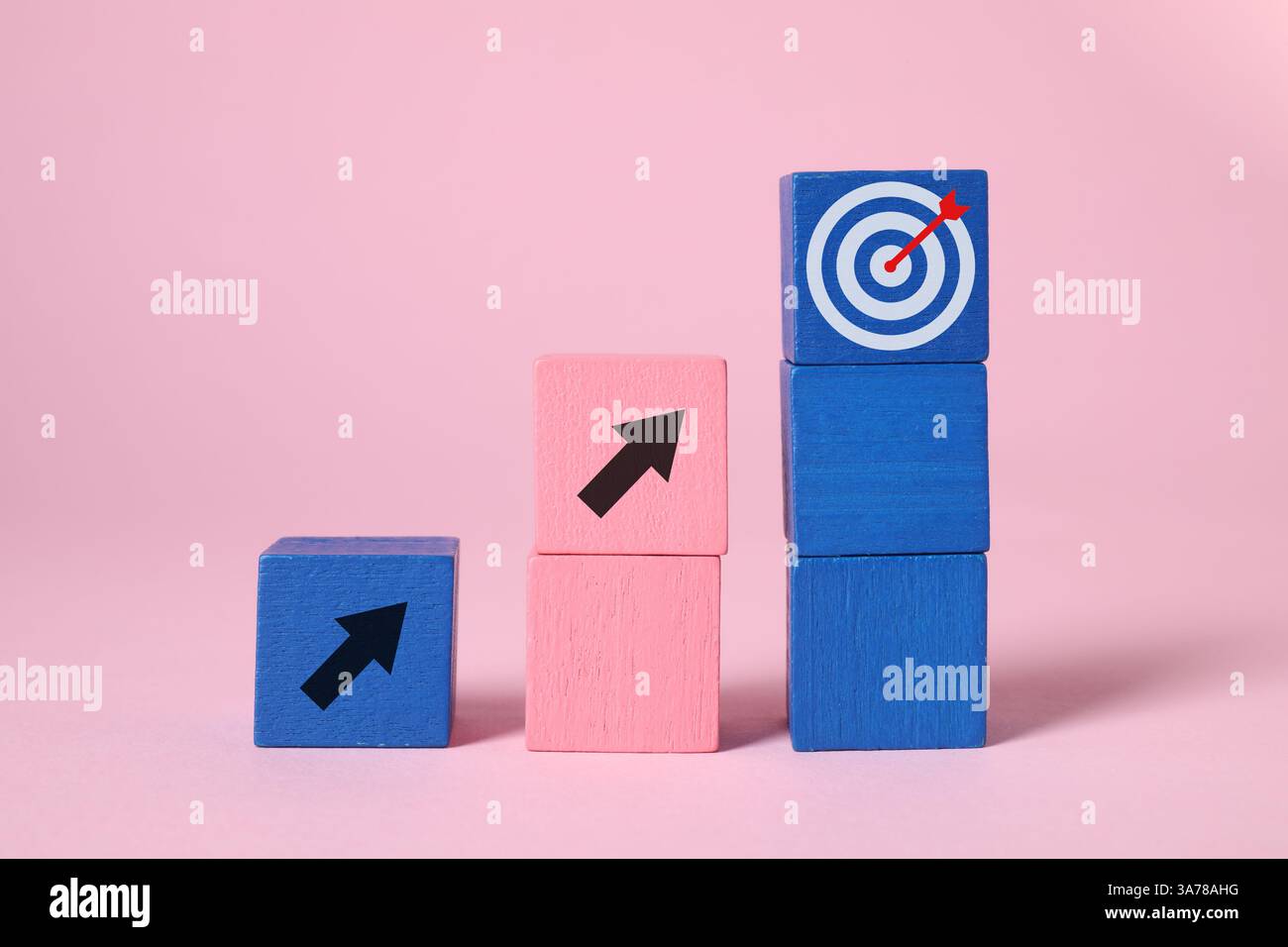 Targeting. Stacked cubes with arrows pointing at one with bullseye on ...