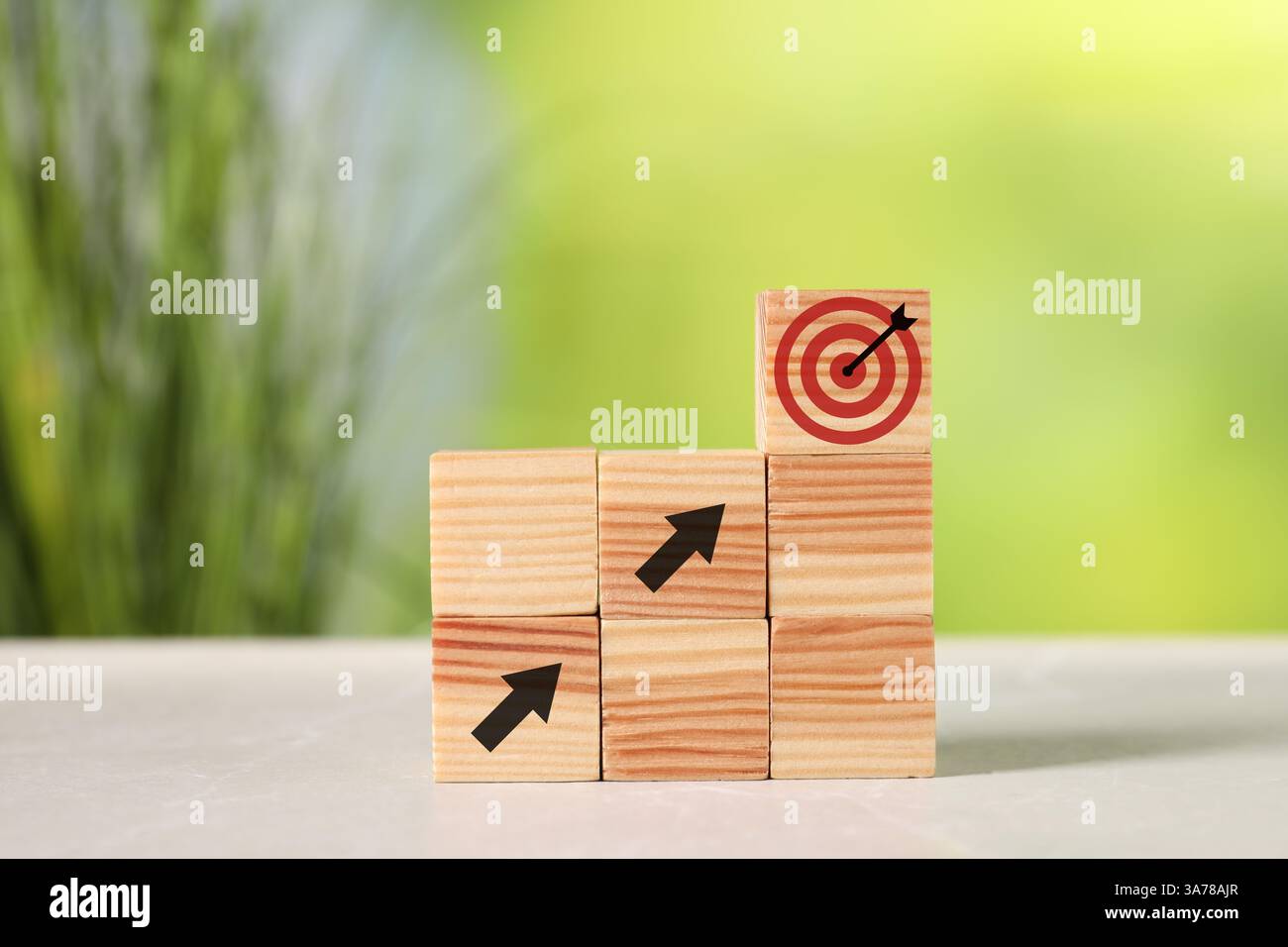 Targeting. Stacked cubes with arrows pointing at one with bullseye on ...