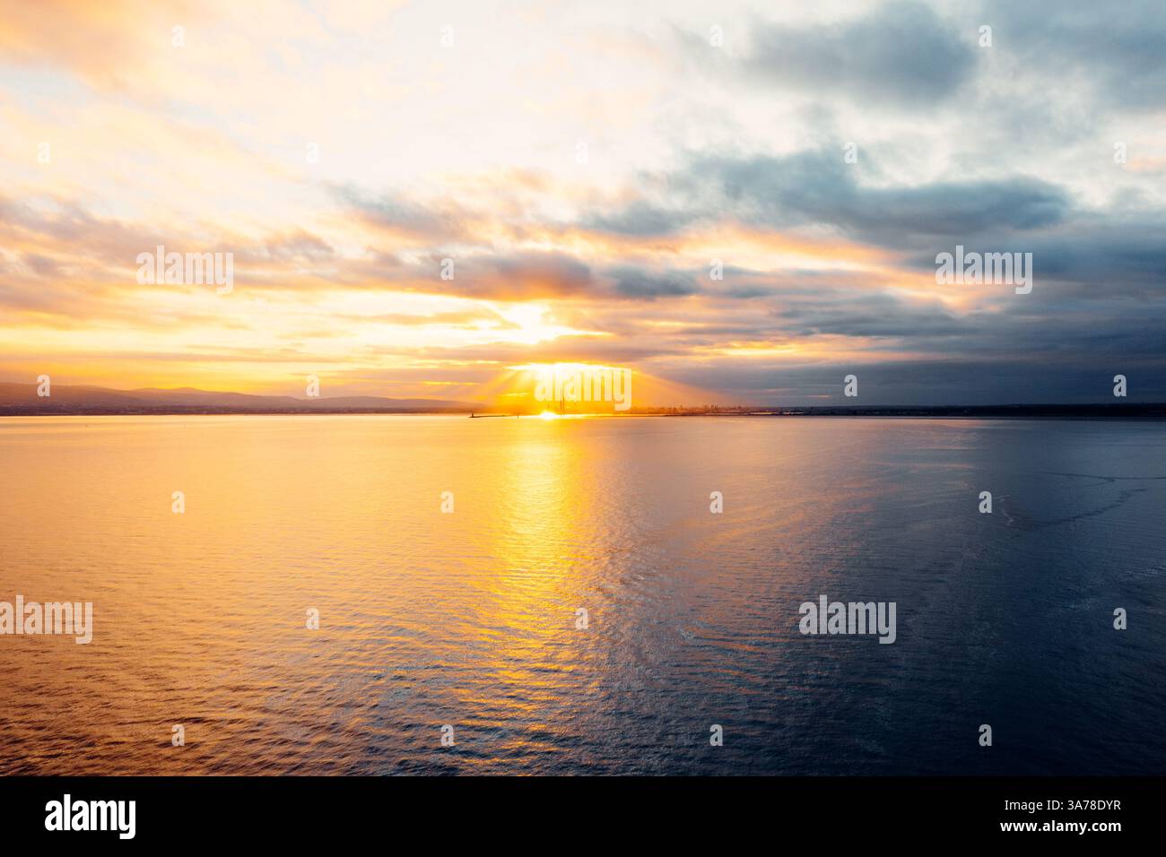 Golden Hour Majesty: Aerial Sunset Over Poolbeg Towers and Lighthouse, Dublin Skyline Aglow with ...