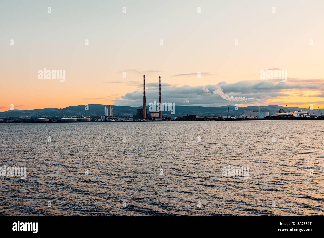Golden Sunset Over Dublin Port With The View of Poolbeg Towers Stock ...
