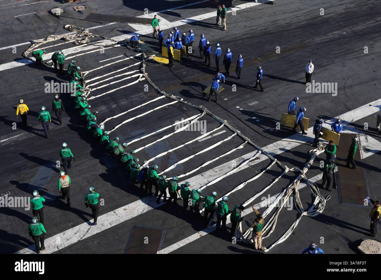 Atlantic Ocean. 20th Mar, 2025. Sailors assigned to air department ...