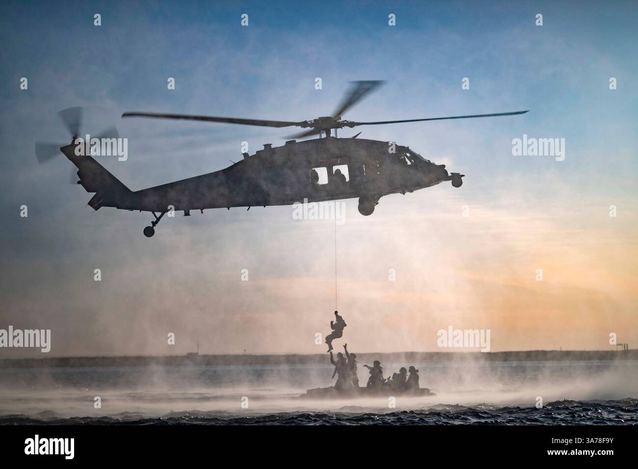 San Diego, California, USA. 19th Mar, 2025. A Sailor lowers from an MH ...